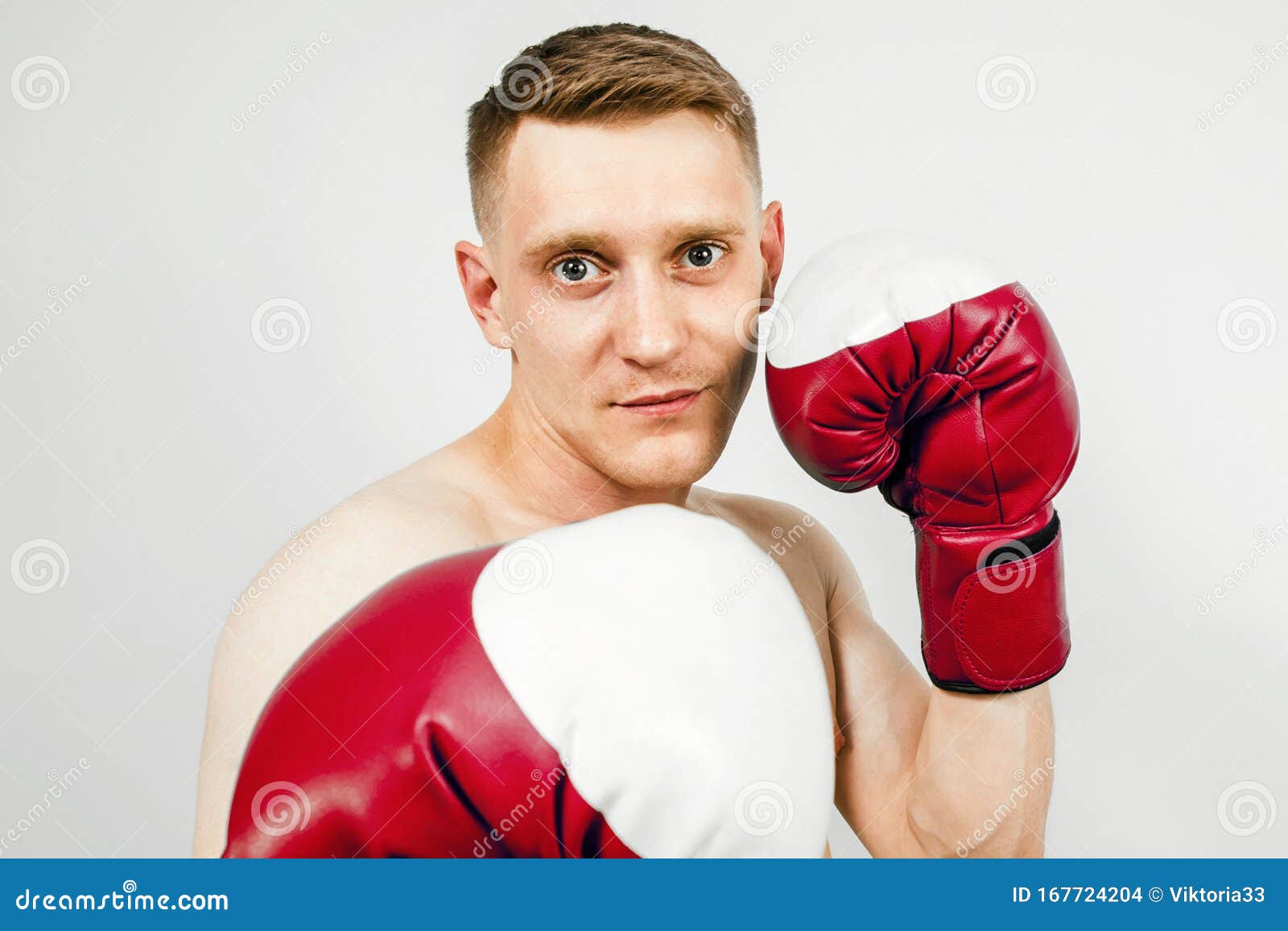 Young Man in Boxing Gloves on a Light Background Stock Photo - Image of ...