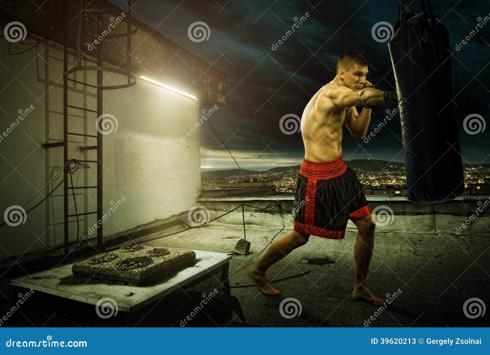 Young Man Boxing Training , on Top of the House Above the City Stock ...