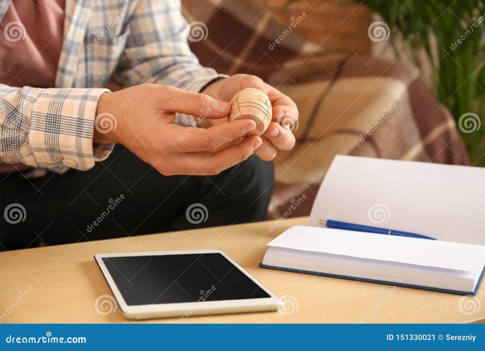 Young Man with Brain Teaser at Table Indoors Stock Image - Image of ...
