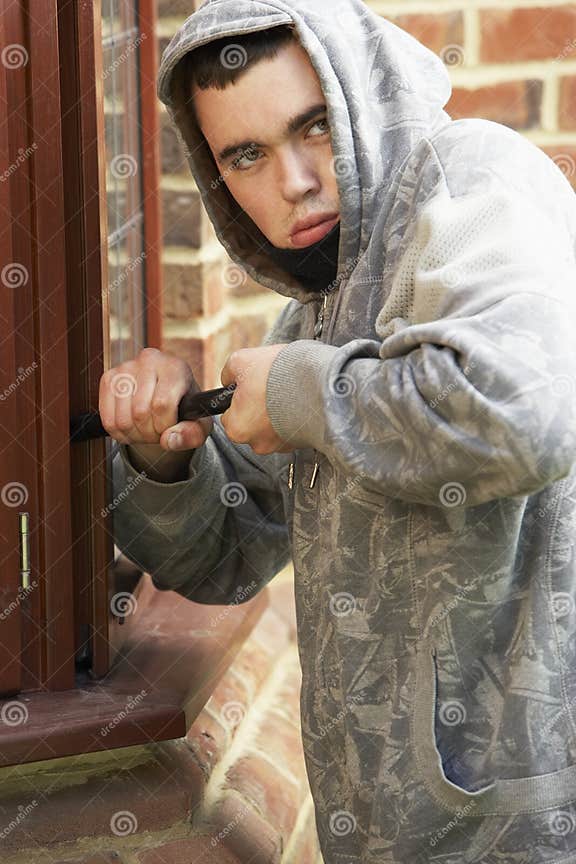 Young Man Breaking into House Stock Photo - Image of street, person ...