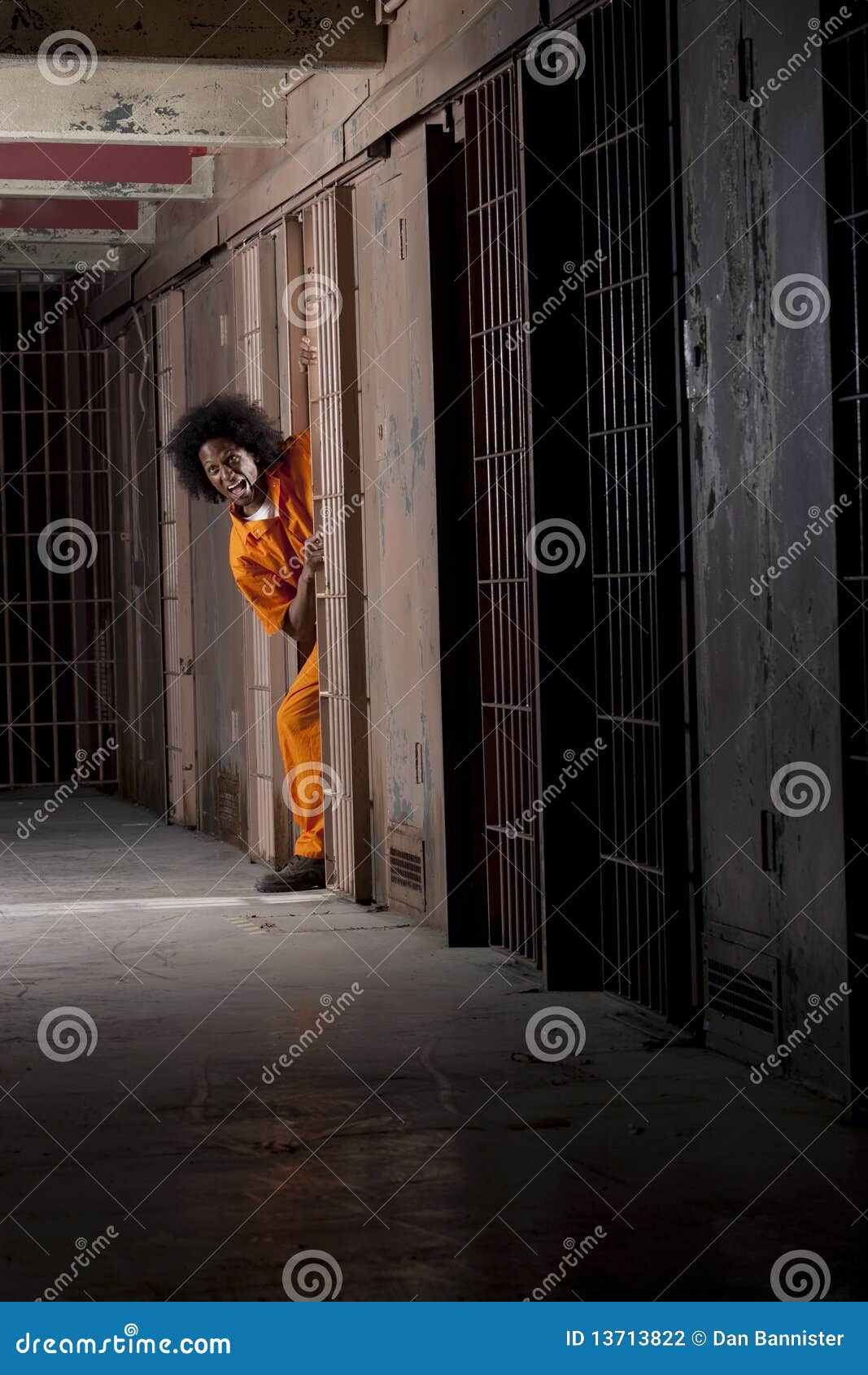 Young Man Breaking Out of Prison Stock Photo - Image of male, jumpsuit ...