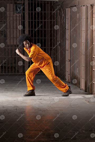 Young Man Breaking Out of Prison Stock Photo - Image of african, bars ...