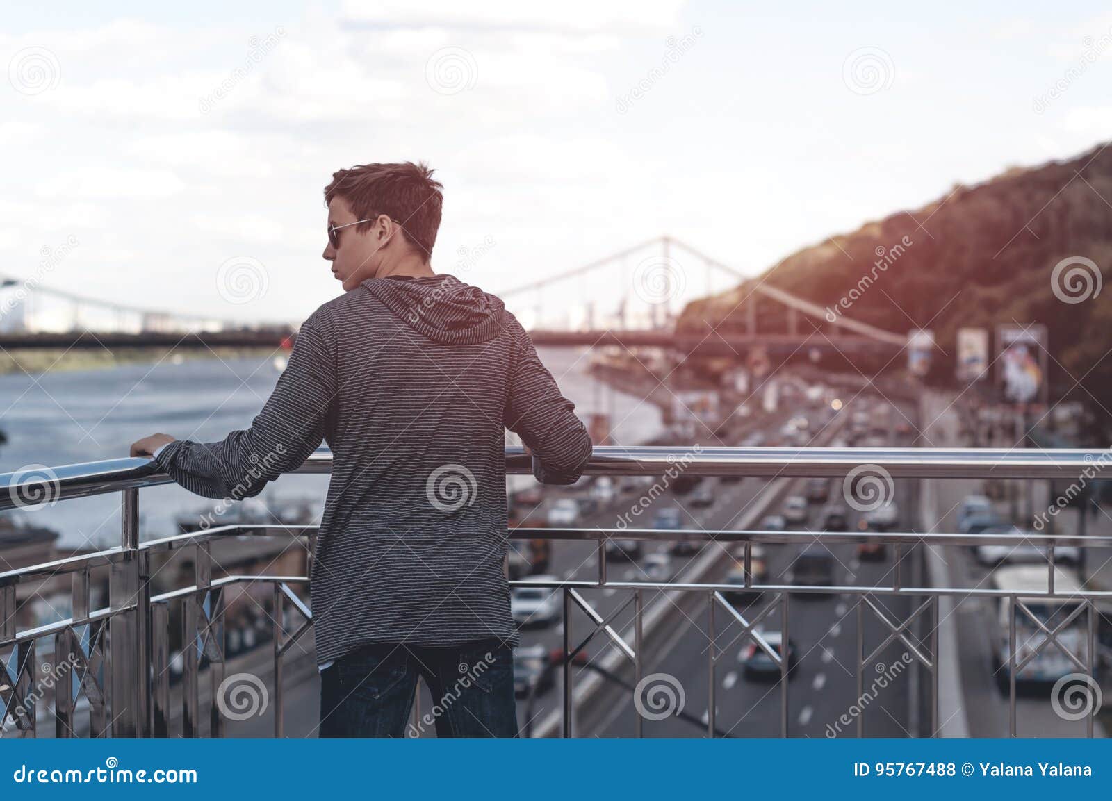 Young Man on a Bridge in a Big City Stock Photo - Image of river ...