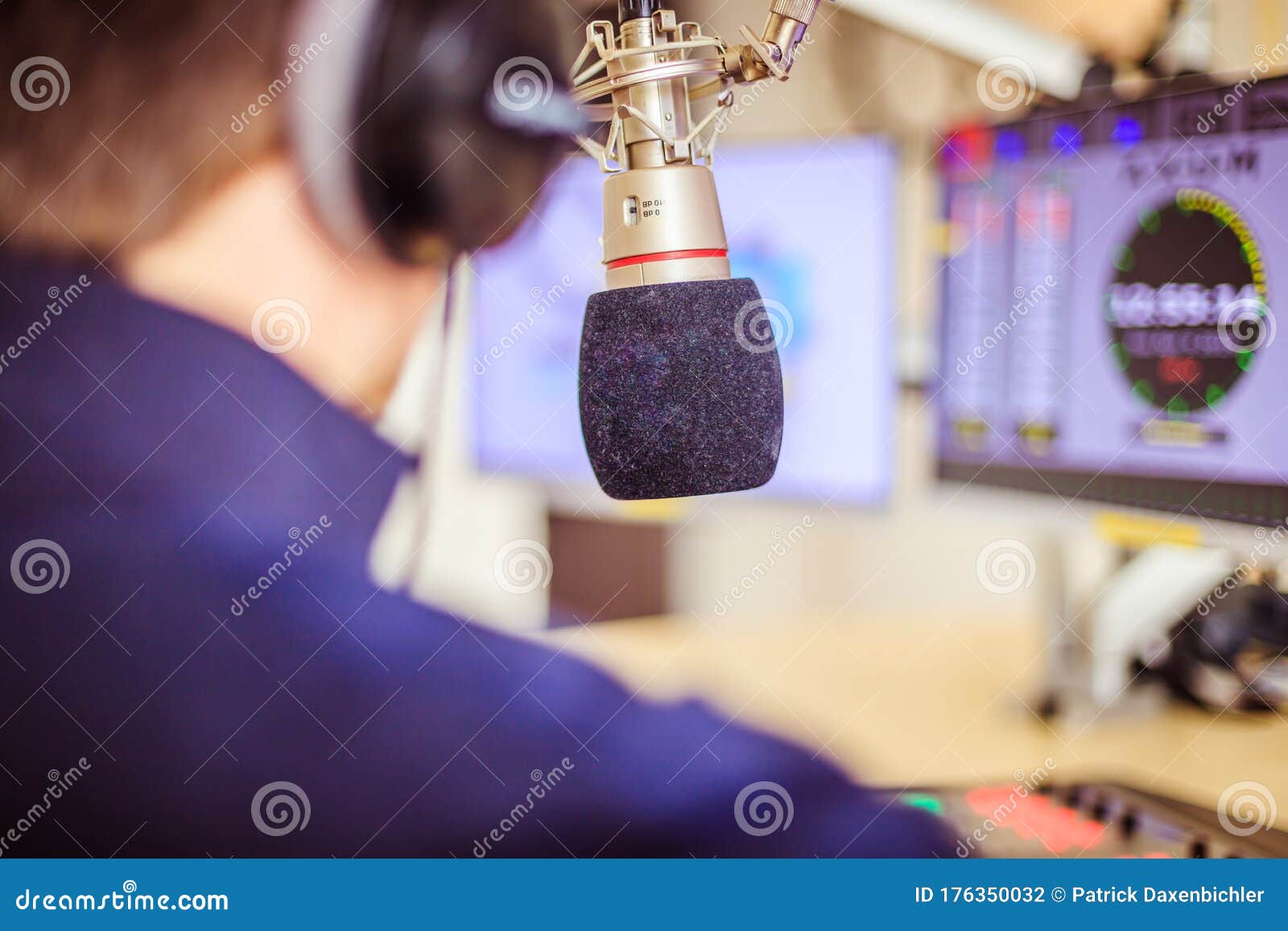 Radio Moderator is Sitting in a Modern Broadcasting Studio and Talking ...