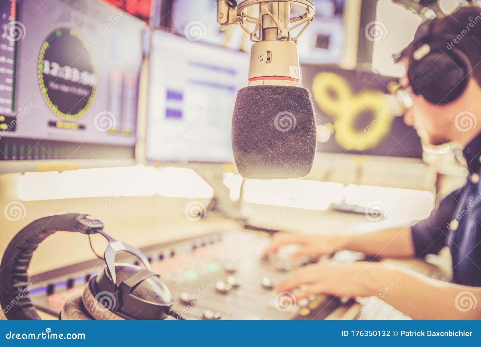 Radio Moderator is Sitting in a Modern Broadcasting Studio and Talking ...