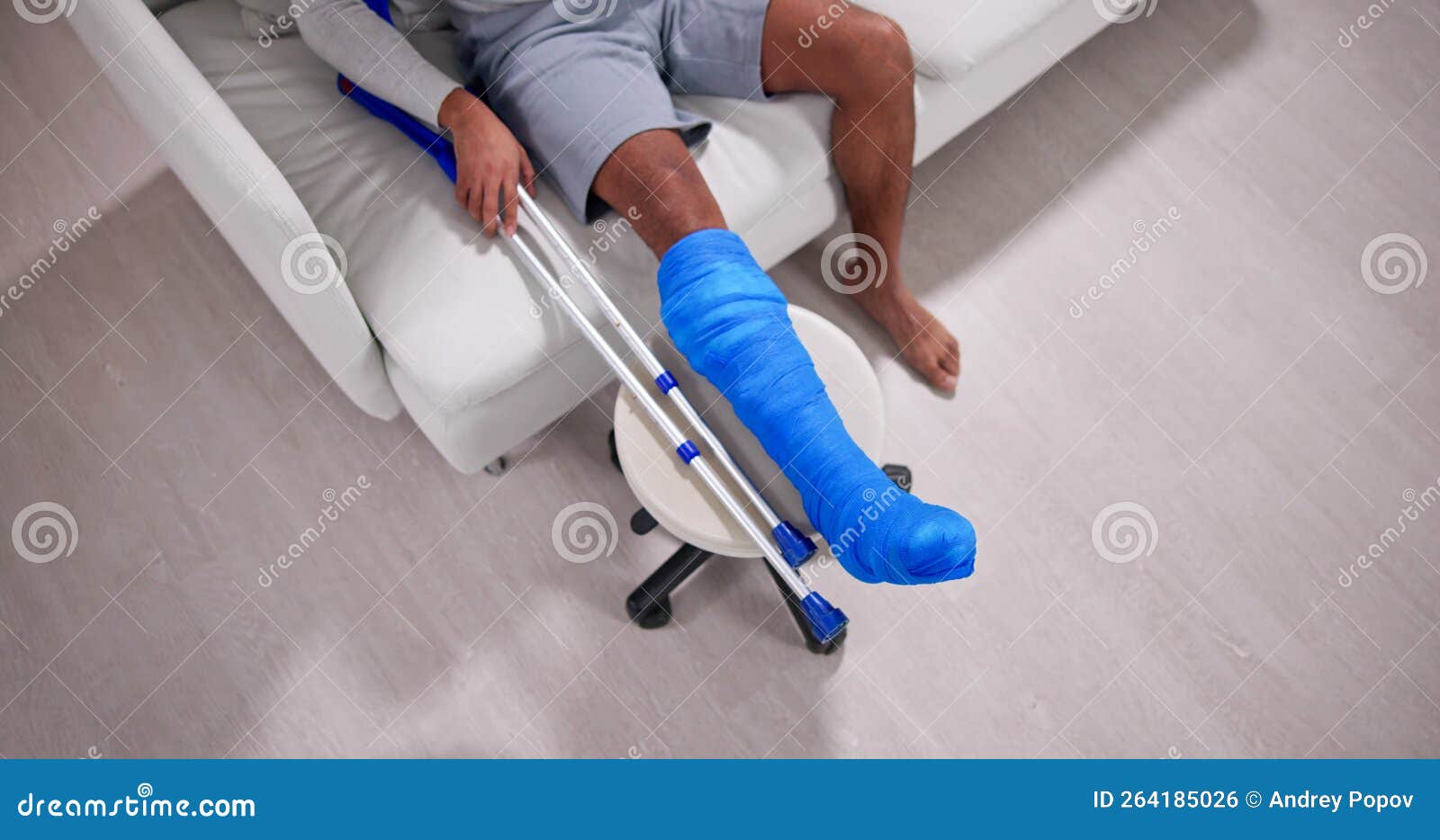 Young Man with Broken Leg Sitting Stock Photo - Image of injury ...