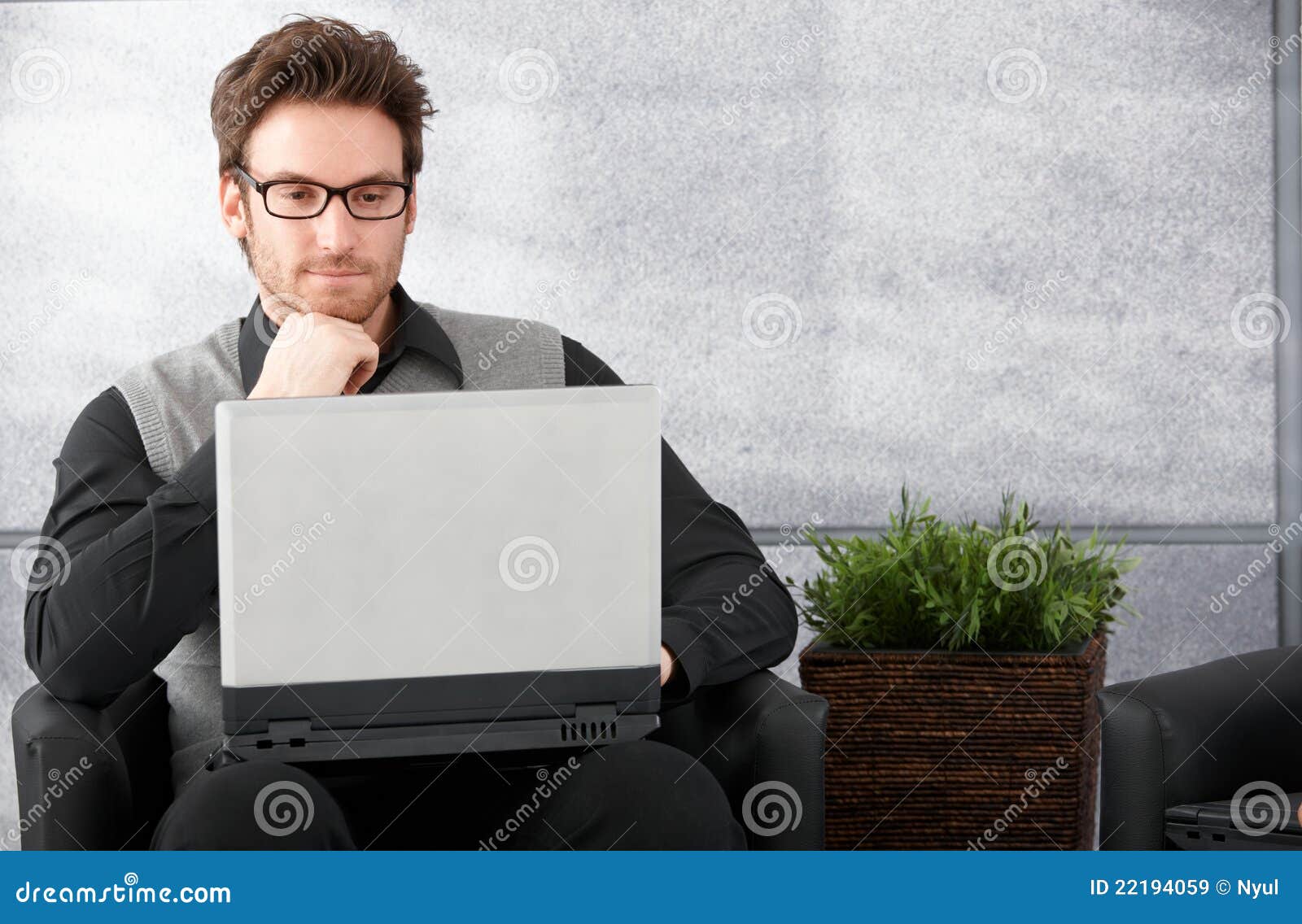 Young Man Browsing Internet on Laptop Stock Image - Image of ...