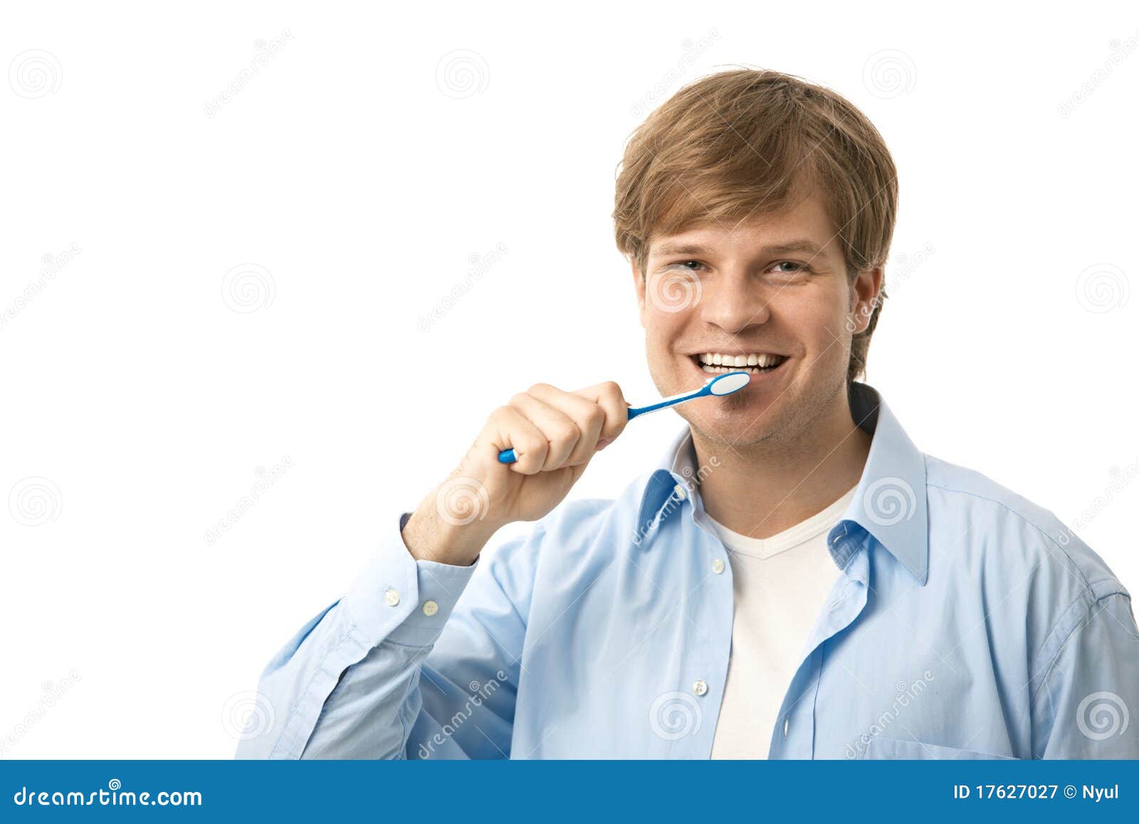 Young man brushing teeth stock image. Image of face, mood - 17627027