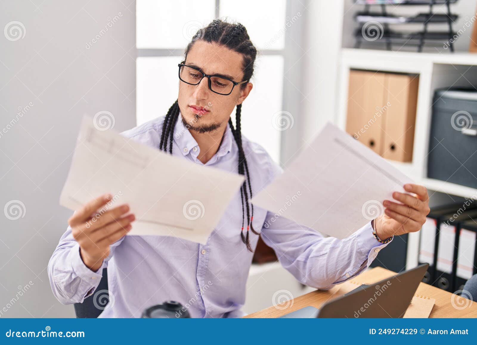 Young Man Business Worker Reading Document Working at Office Stock ... Young Man Business Worker Reading Document Working at Office Stock ...