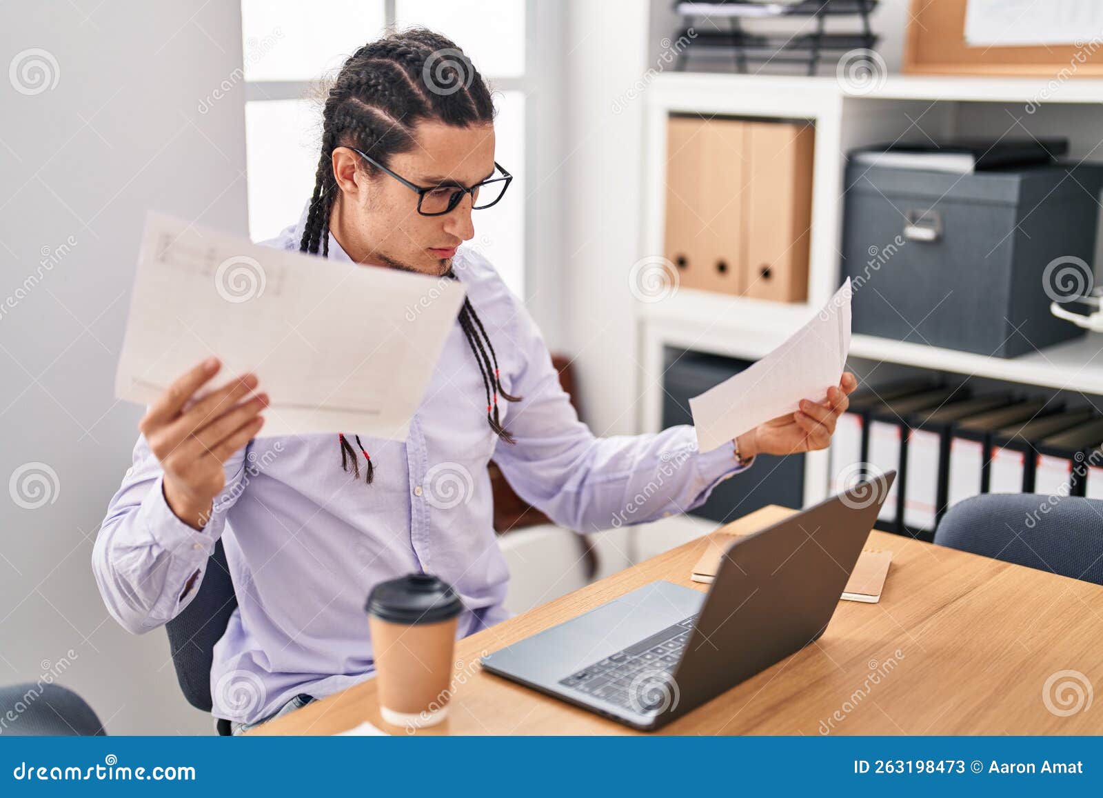 Young Man Business Worker Reading Document Working at Office Stock ... Young Man Business Worker Reading Document Working at Office Stock ...