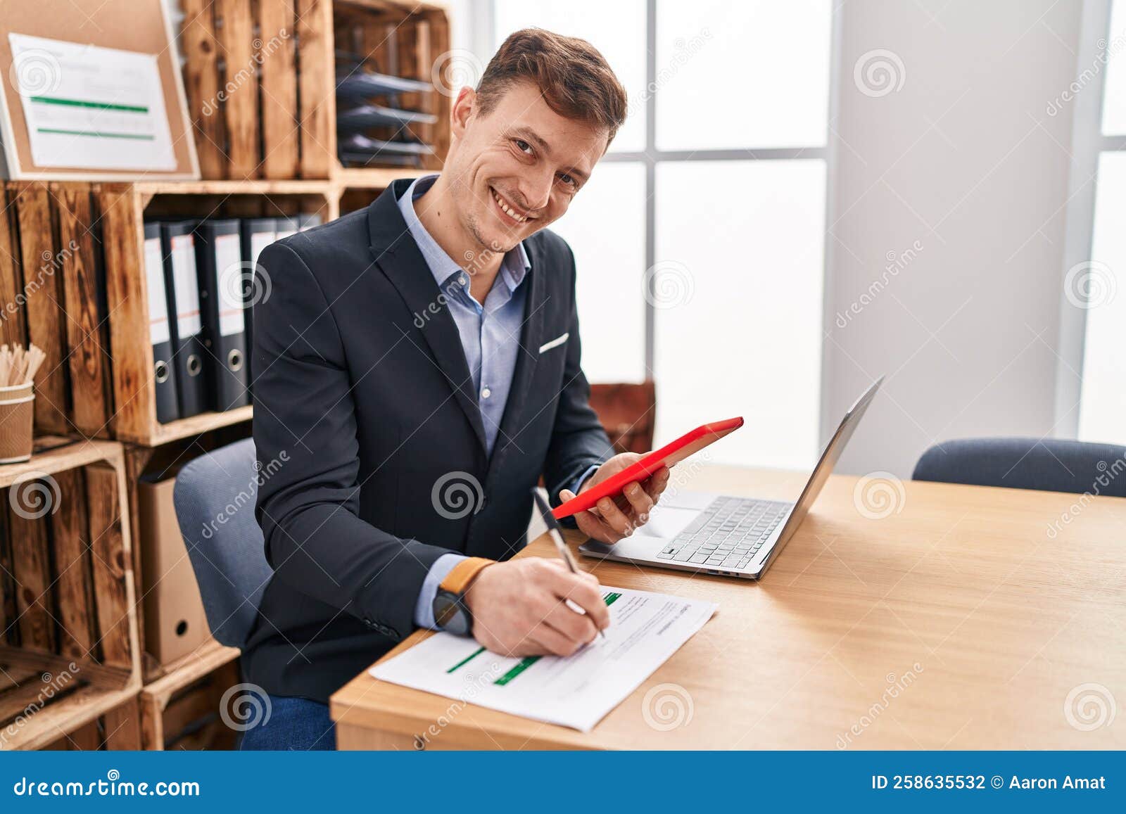 Young Man Business Worker Using Touchpad Writing on Document at Office ...