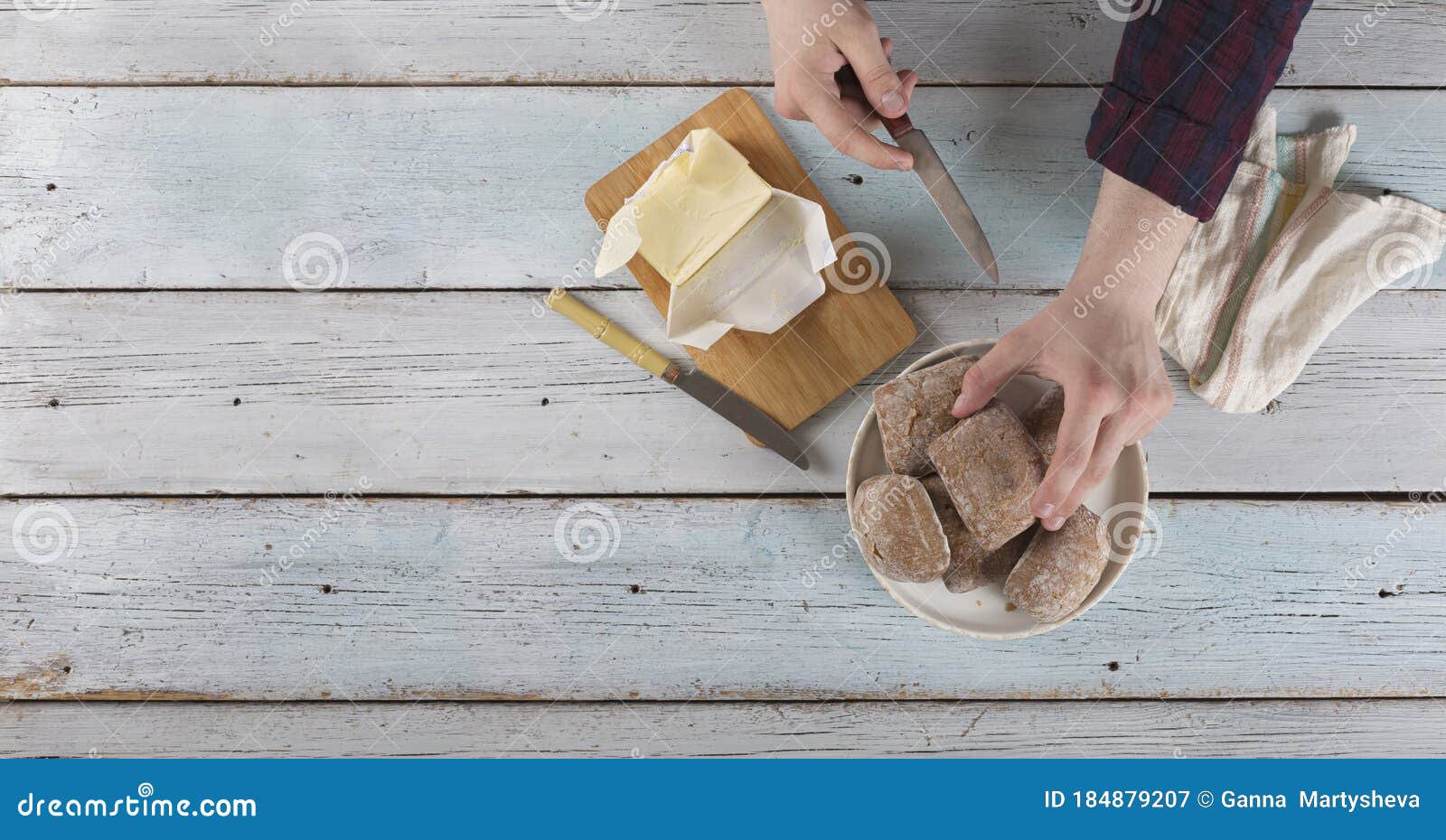 Young Man Buttering Butter on Bun on an Old Rustic Table Stock Image ...