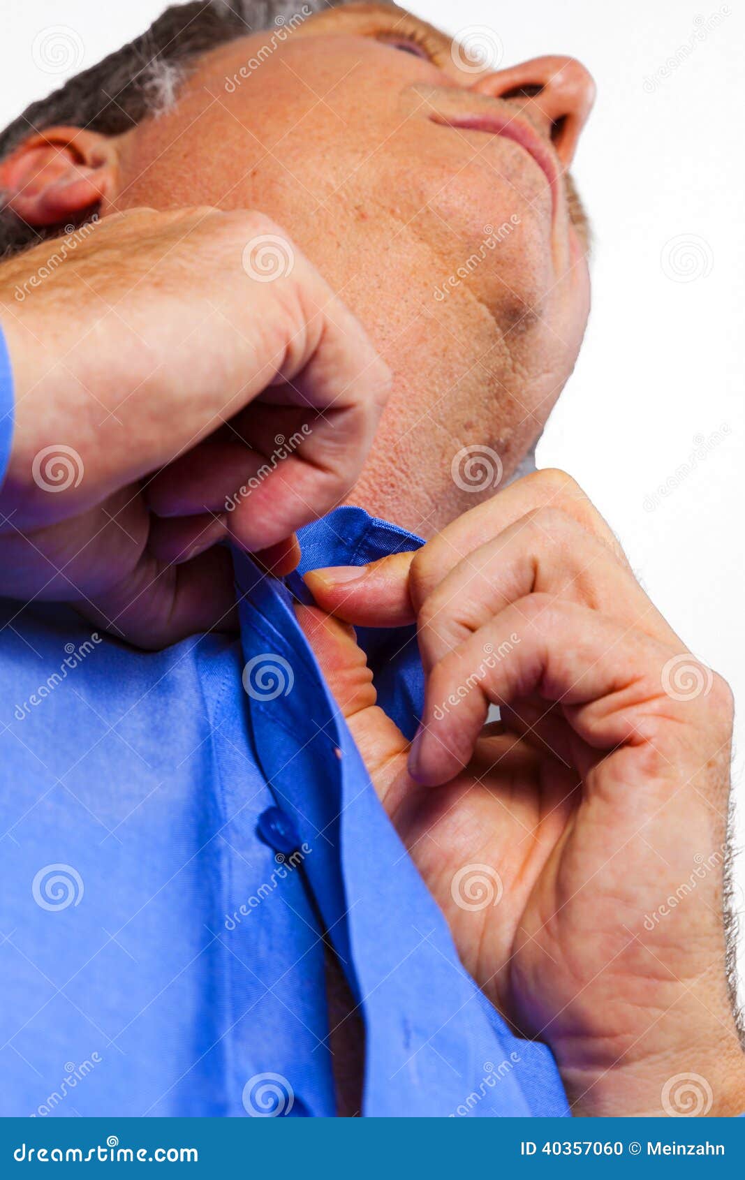 Young Man Buttoning-up His Shirt Stock Photo - Image of face, dressing ...
