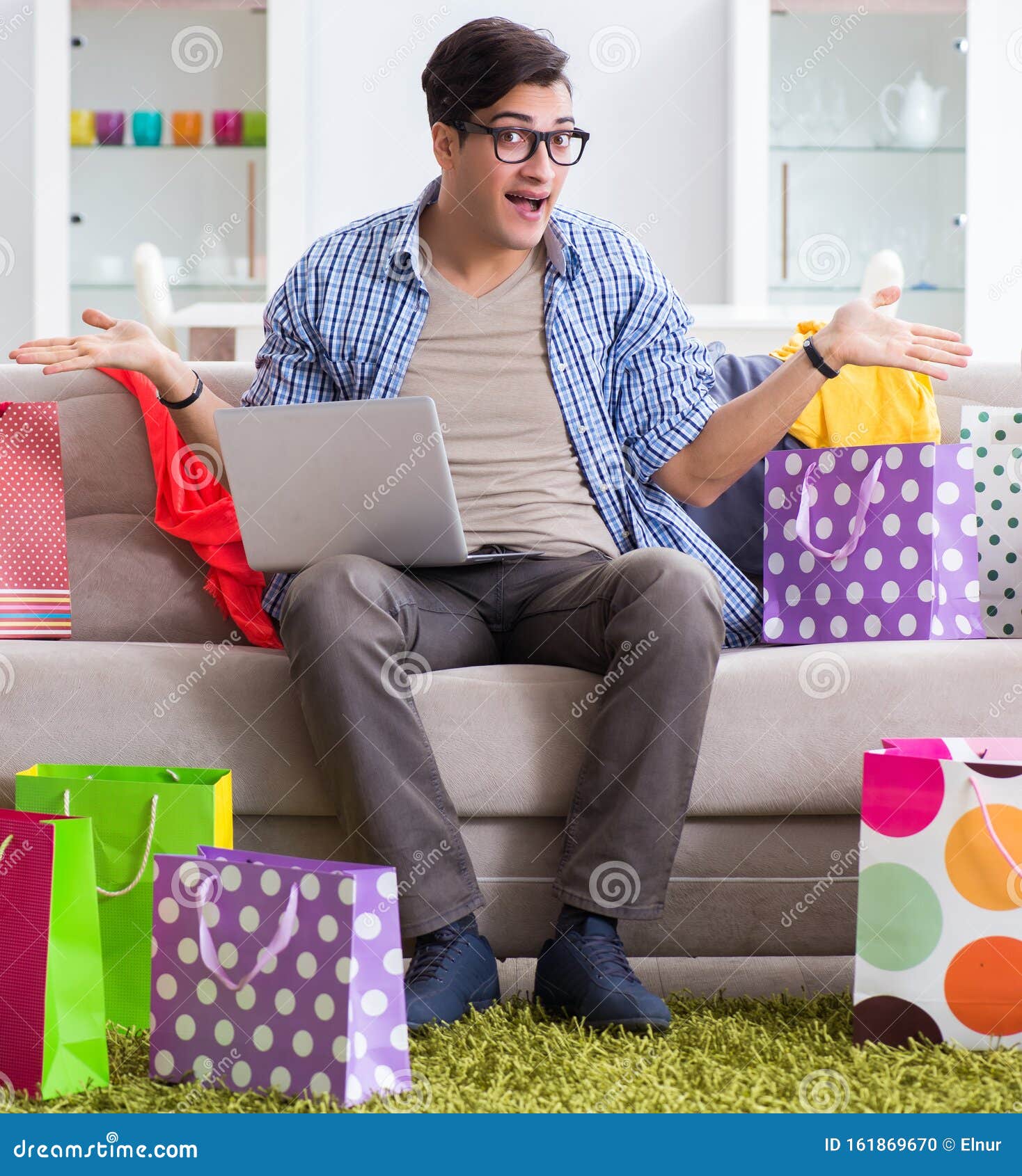 The Young Man Buying Clothing Online and Running Blog Stock Photo ... The Young Man Buying Clothing Online and Running Blog Stock Photo ...