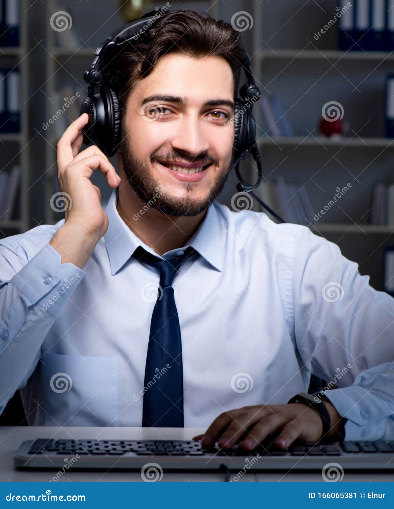 Young Man in Call Center Concept Working Late Overtime in Office Stock ...