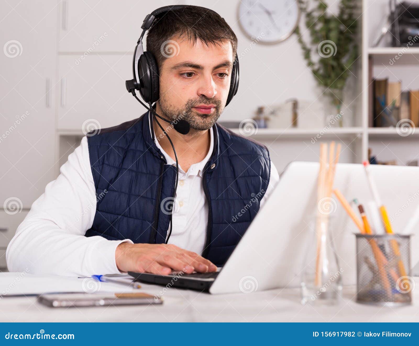 Young Man Call Centre Operator with Headphones Working Stock Photo ...