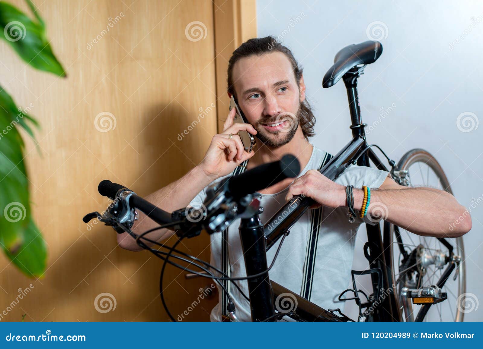 Young Man Calling with Bike on the Shoulder Stock Image - Image of ...