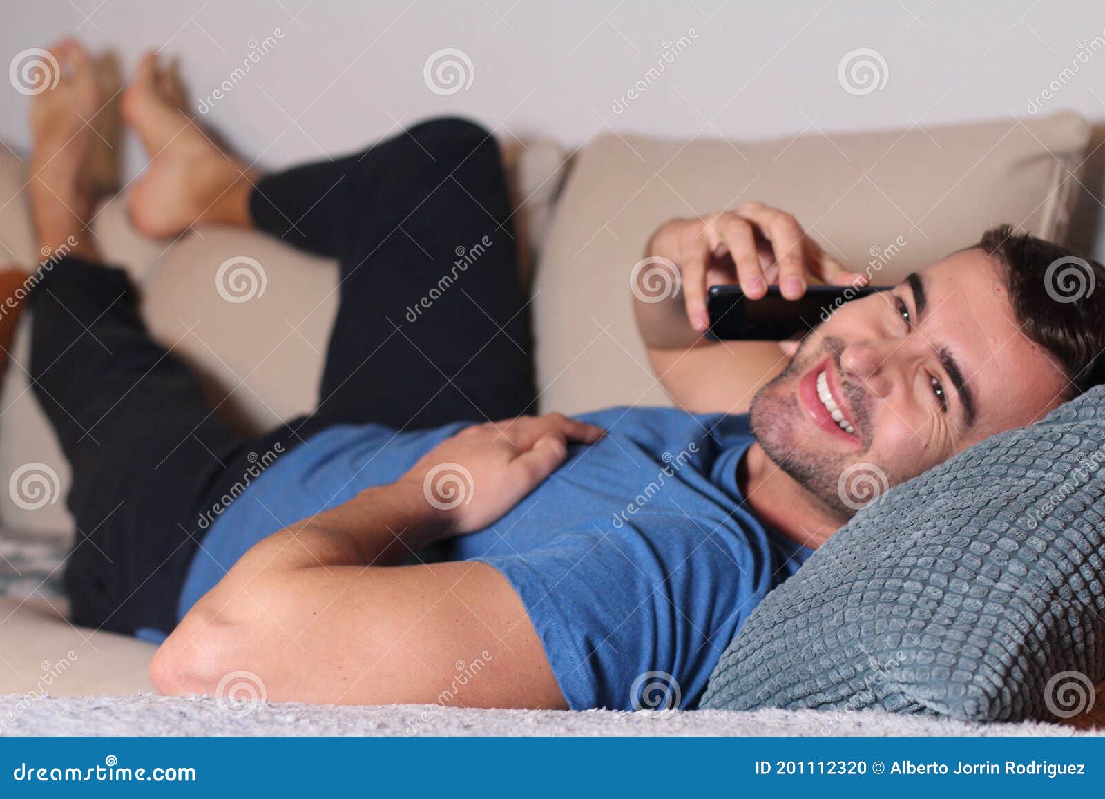 Young Man Calling from Home Stock Photo - Image of hispanic, caucasian ...