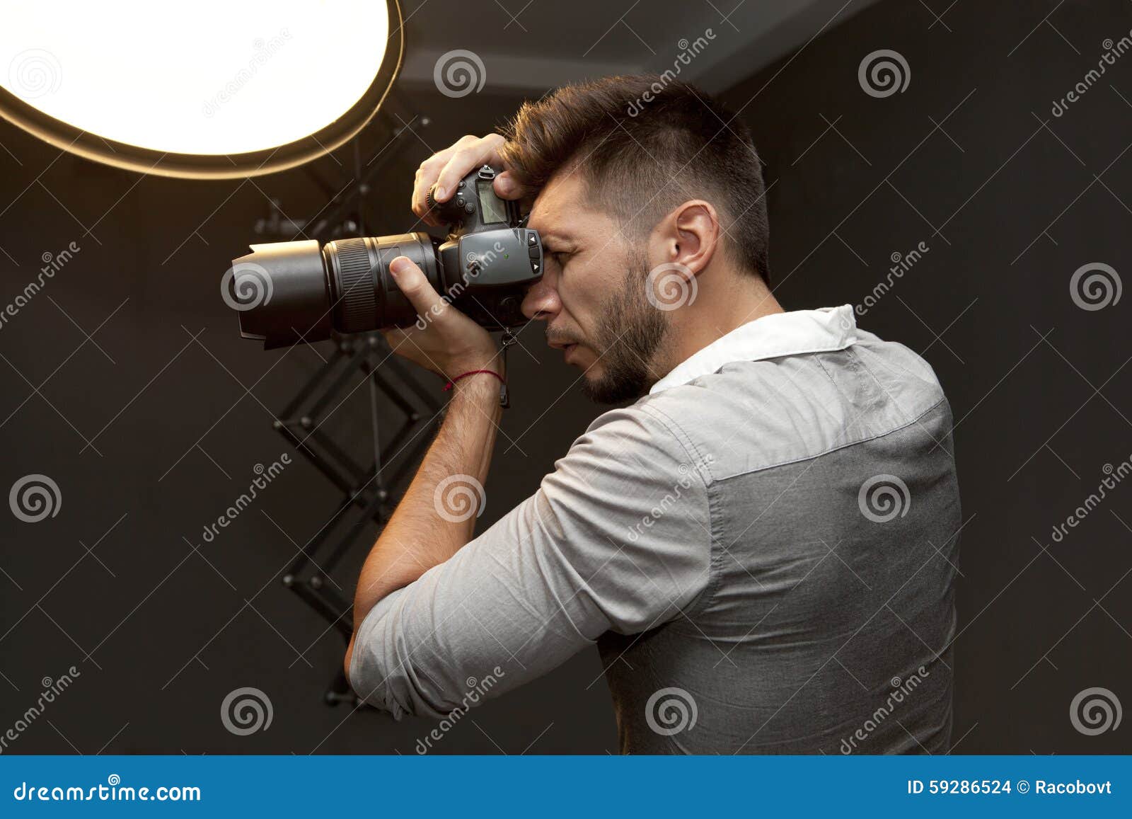 Young man with camera stock photo. Image of good, digital - 59286524