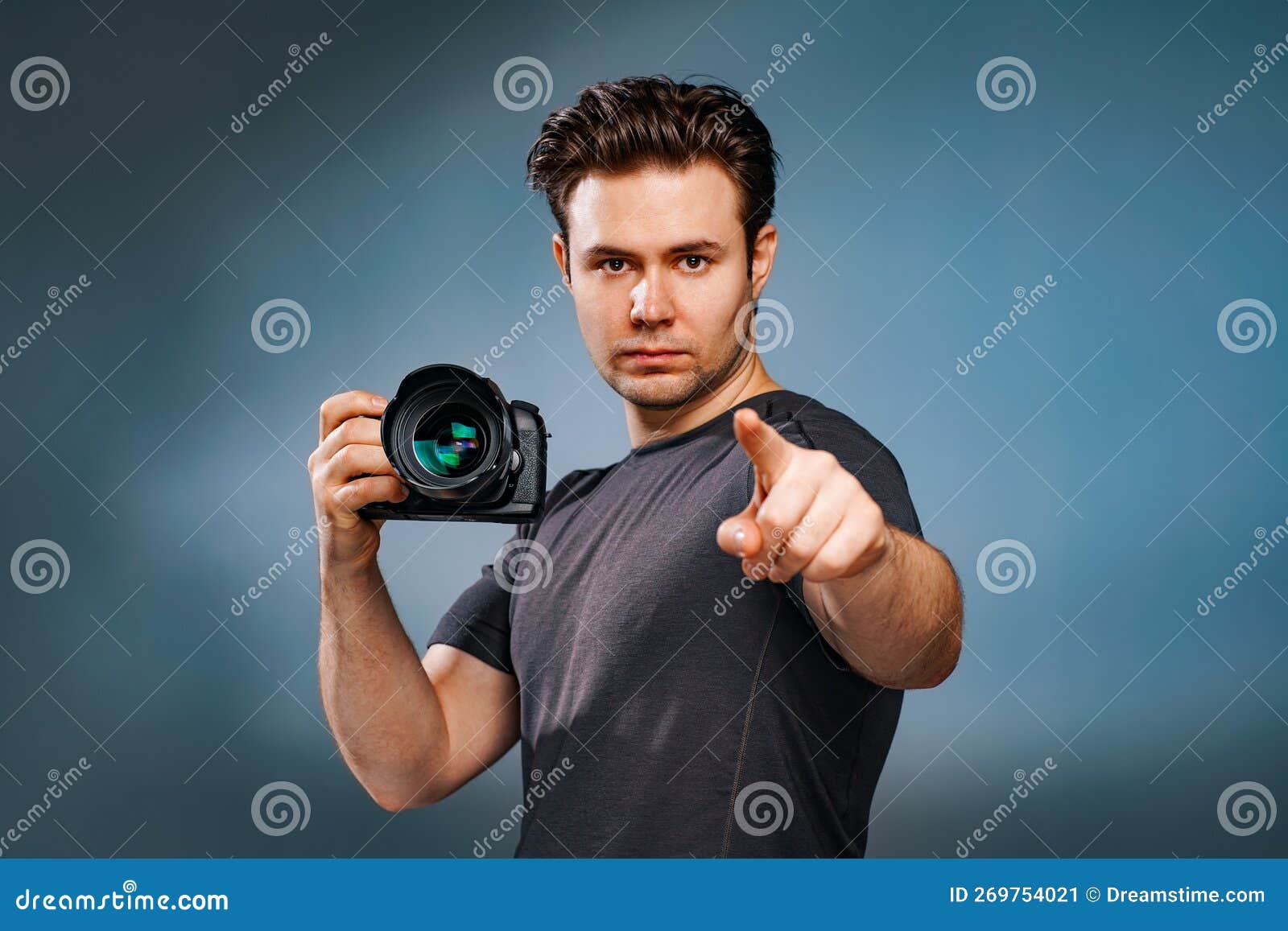 Young man with camera stock image. Image of handsome - 269754021