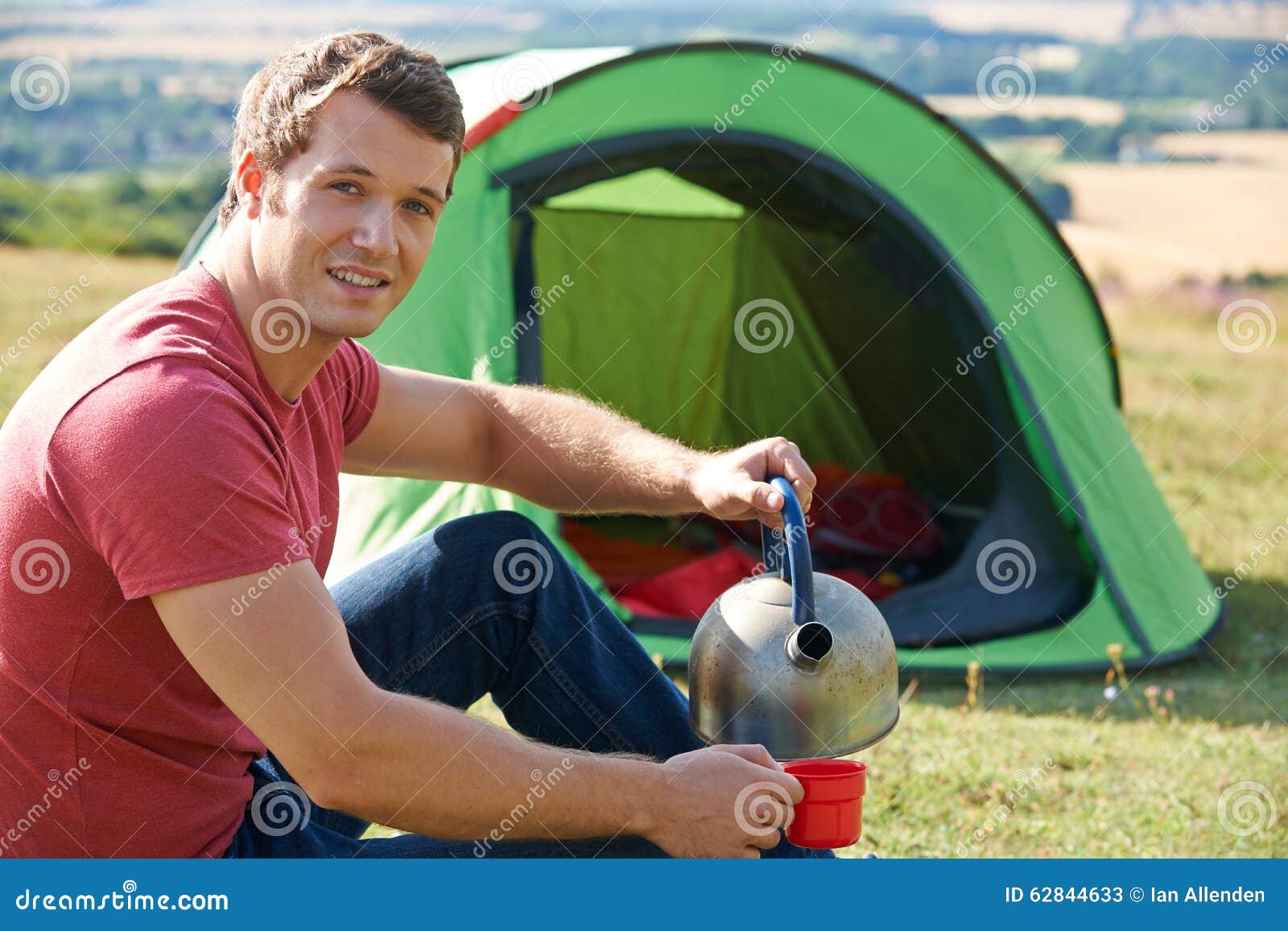 Young Man Camping in Countryside Stock Image - Image of tent, vacation ...
