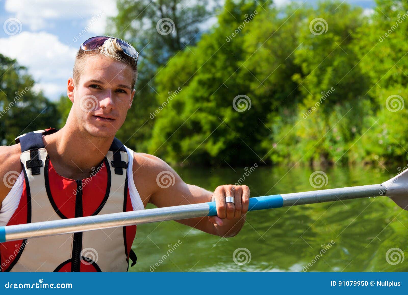 Young Man Canoeing stock photo. Image of canoe, river - 91079950
