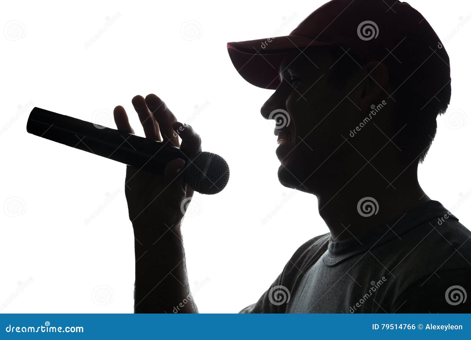 Young Man in Cap Singing into a Microphone Stock Photo - Image of ...