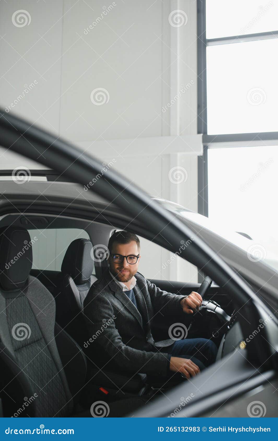 Young Man in the Car Dealership. Stock Image - Image of buying, auto ...