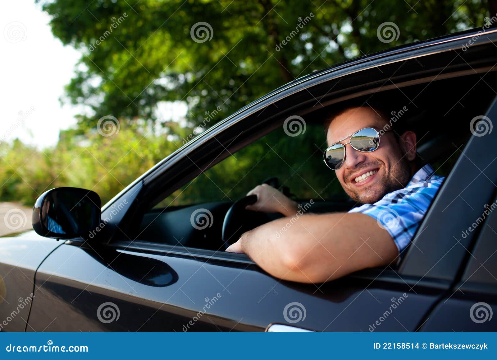 Young man in car smiling stock photo. Image of showing - 22158514