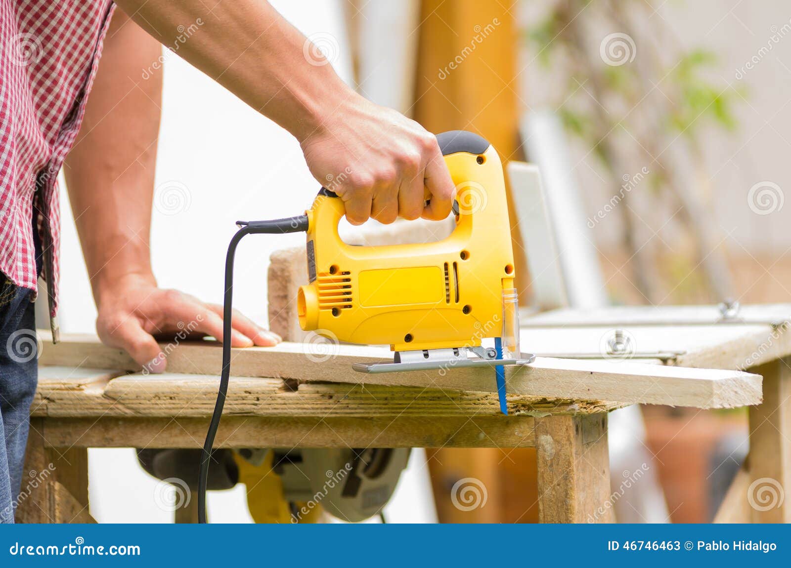 Young Man Carpenter Working with Electric Jigsaw Stock Image - Image of ...
