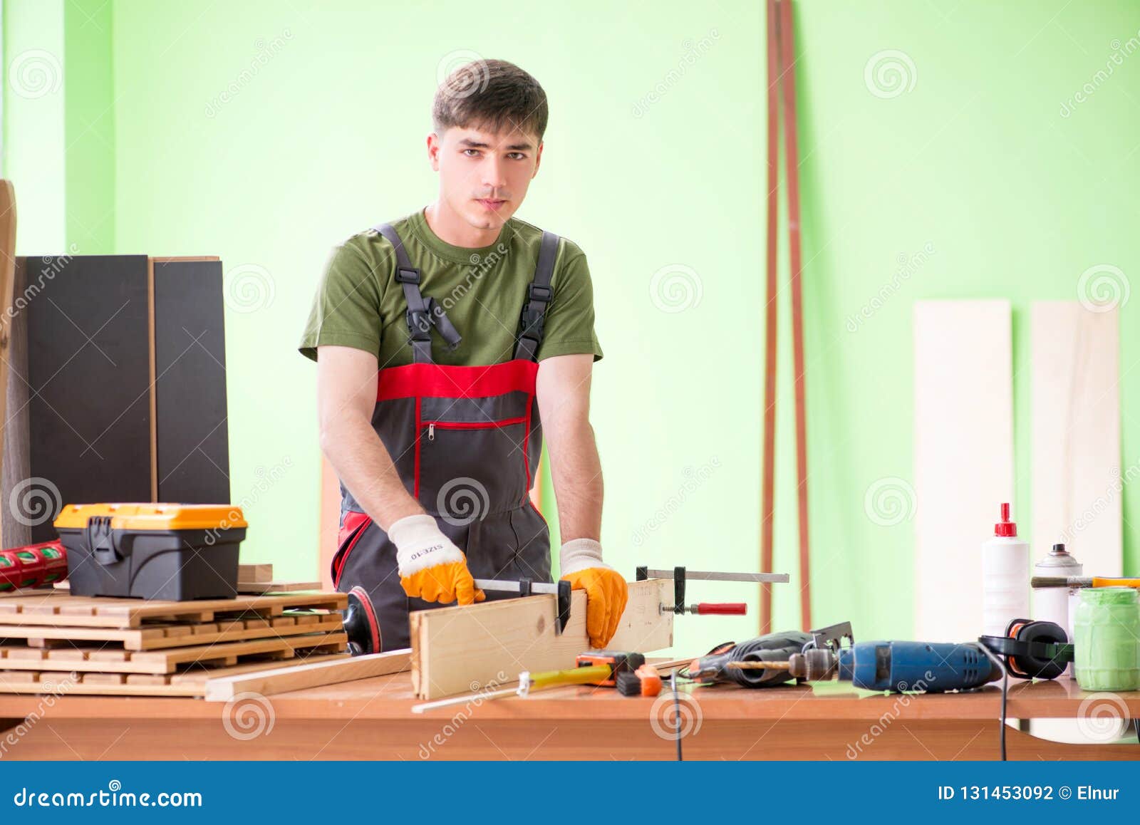 The Young Man Carpenter Working in Workshop Stock Photo - Image of ...