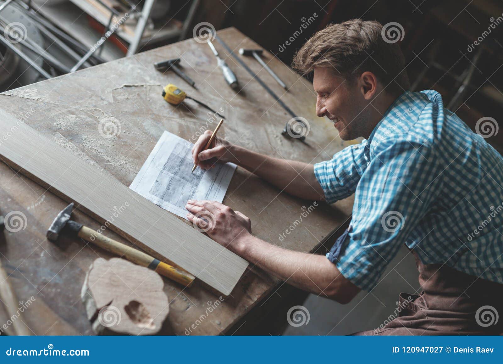 Young man in the carpentry stock image. Image of plank - 120947027