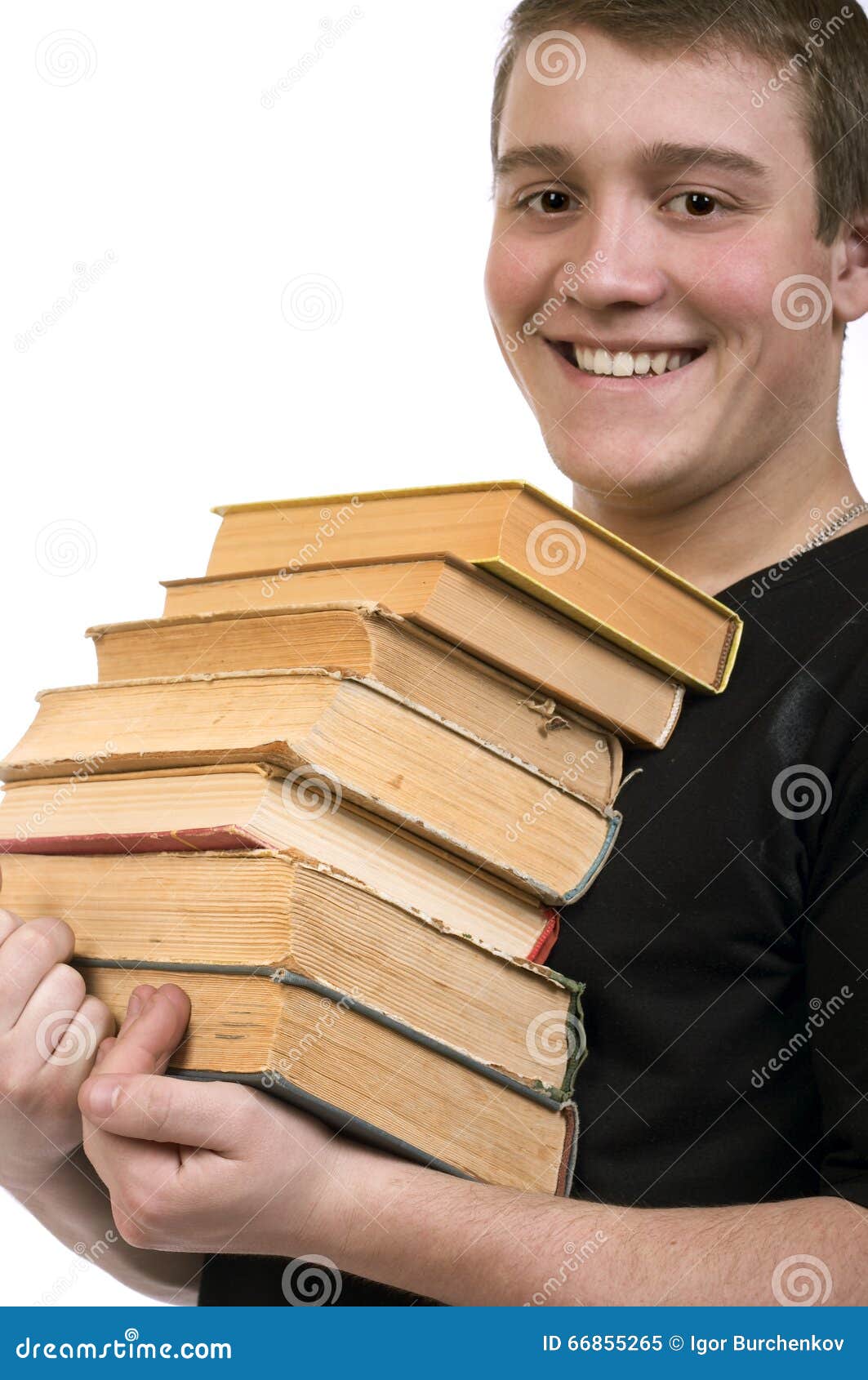 A Young Man Carries a Stack of Books Stock Image - Image of caucasian ...