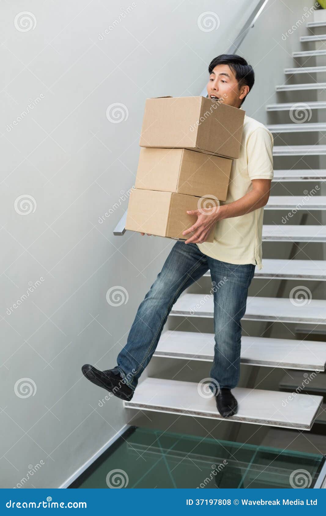 Young Man Carrying Boxes Against Staircase Stock Photo - Image of ...