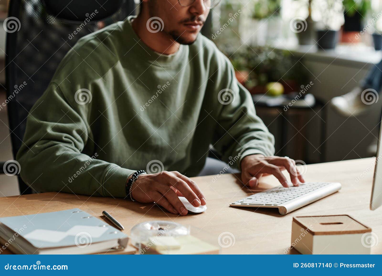 Young Man in Casualwear Clicking Mouse and Pressing Key Stock Photo ...