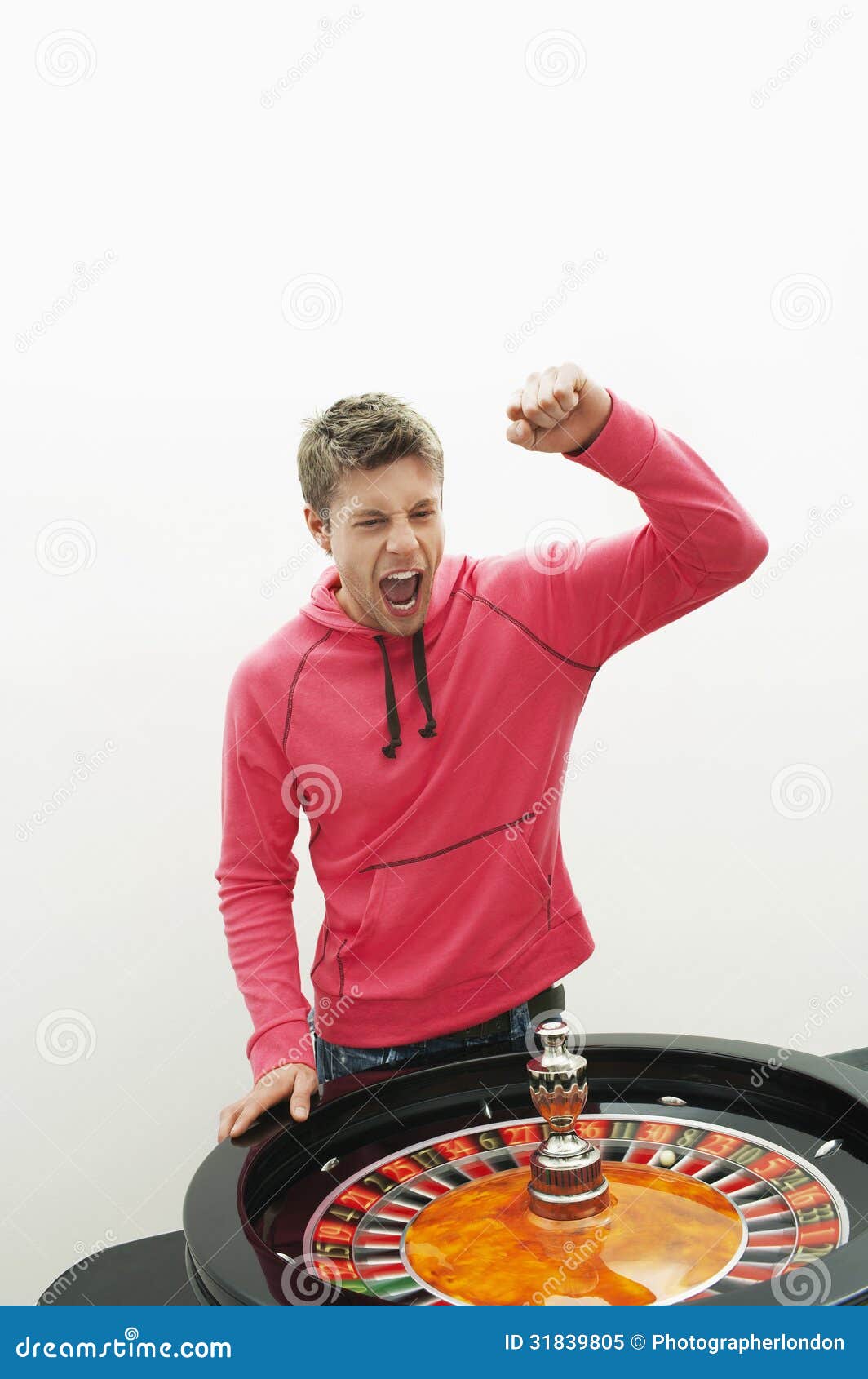 Young Man Celebrating at Roulette Table Stock Image - Image of house ...