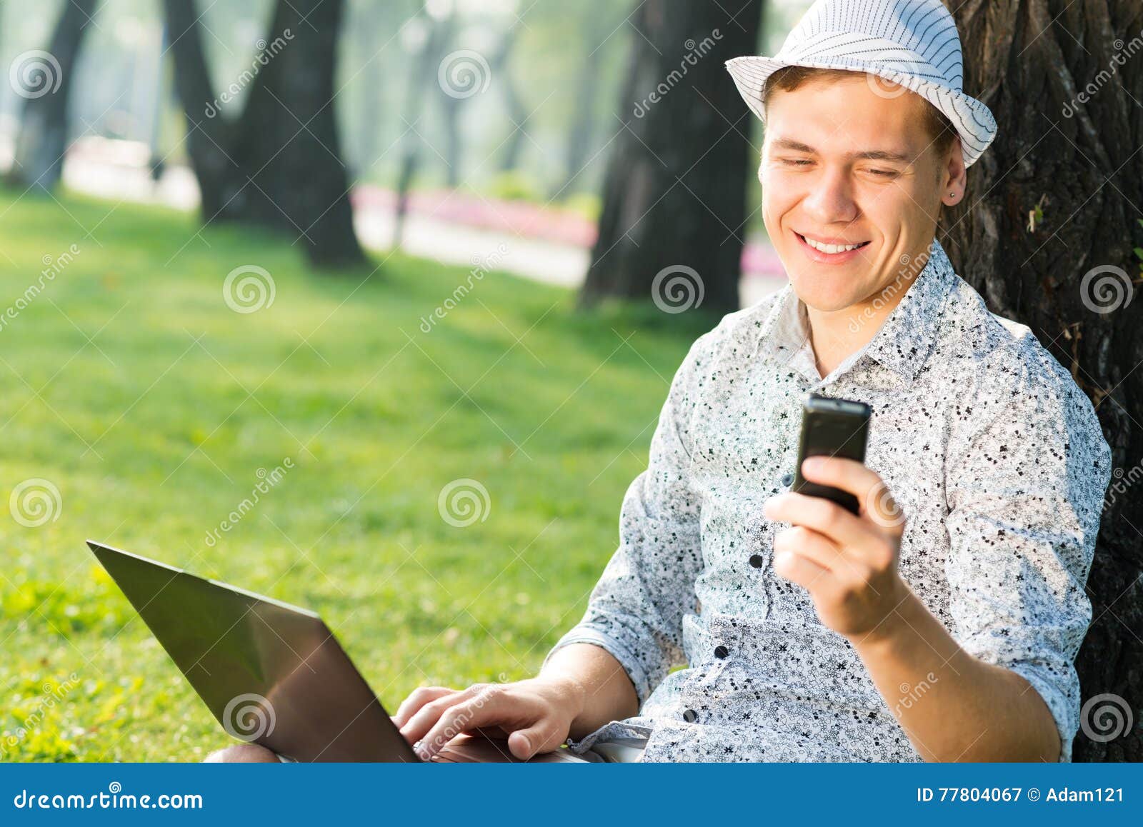 Young Man with a Cell Phone Stock Image - Image of blue, cellphone ...