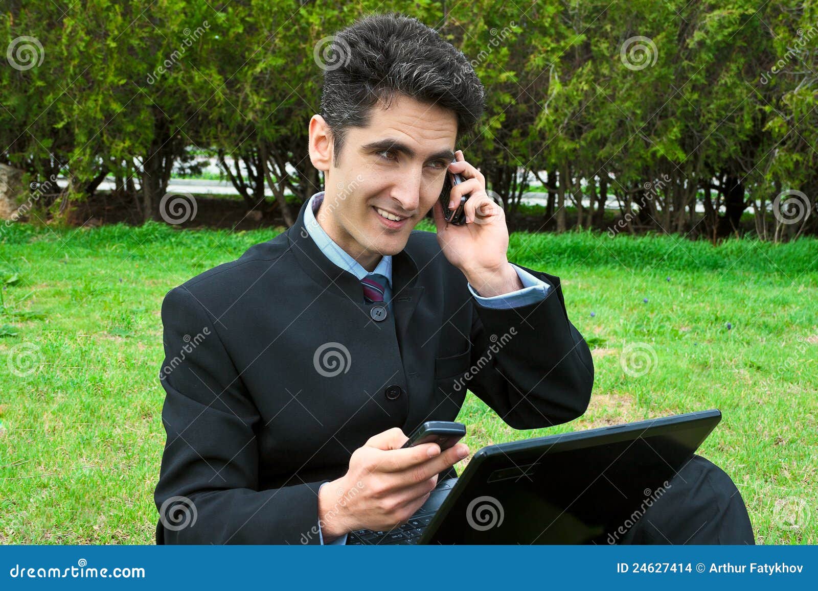 Young Man with Cell Phones and Laptop. Stock Photo - Image of adult ...