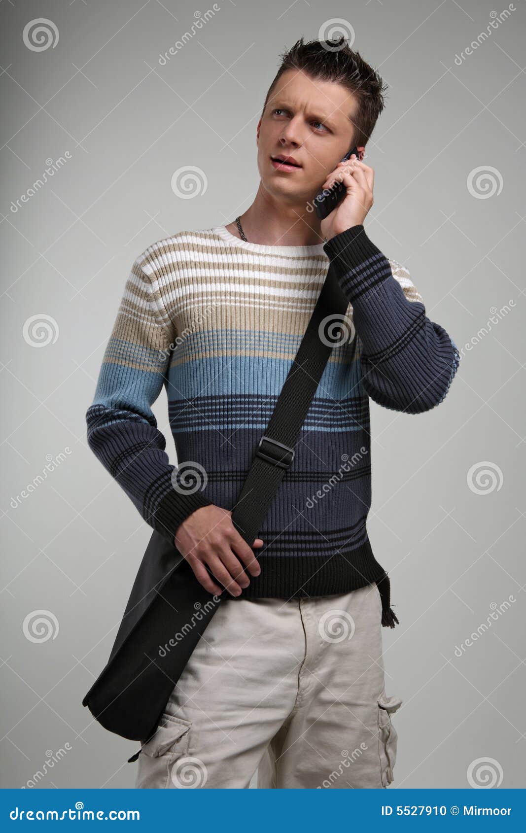 Young man on cellphone stock photo. Image of communicate - 5527910