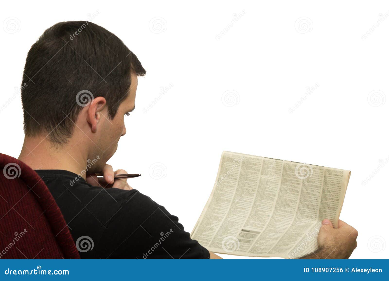 Young Man in Chair Reading a Newspaper with an Advertisement Stock ... Young Man in Chair Reading a Newspaper with an Advertisement Stock ...