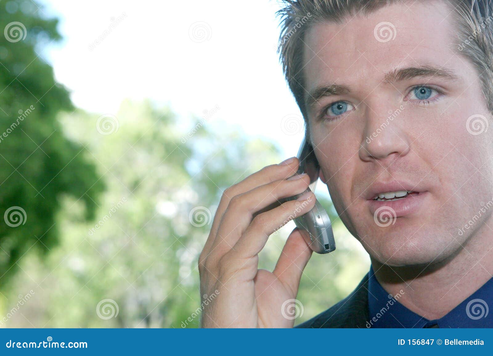 Young Man Chats on Cellphone Stock Image - Image of concrete, hair: 156847