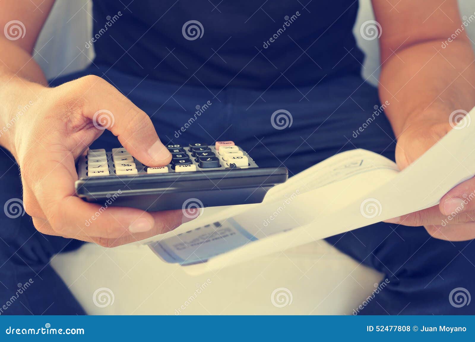 Young Man Checking a Bill, a Budget or a Payroll, Filtered Stock Photo ...