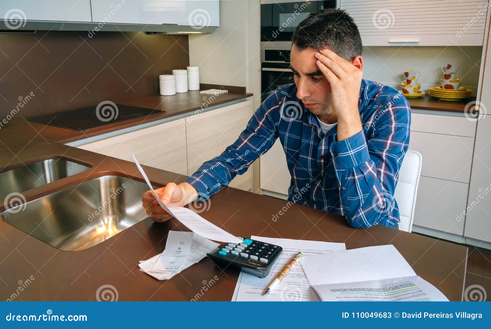 Young man checking bills stock image. Image of bank - 110049683