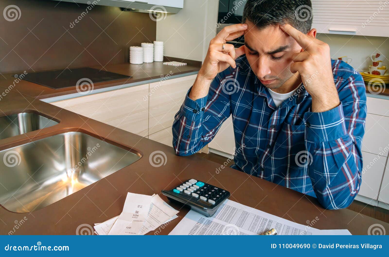 Young man checking bills stock photo. Image of financial - 110049690