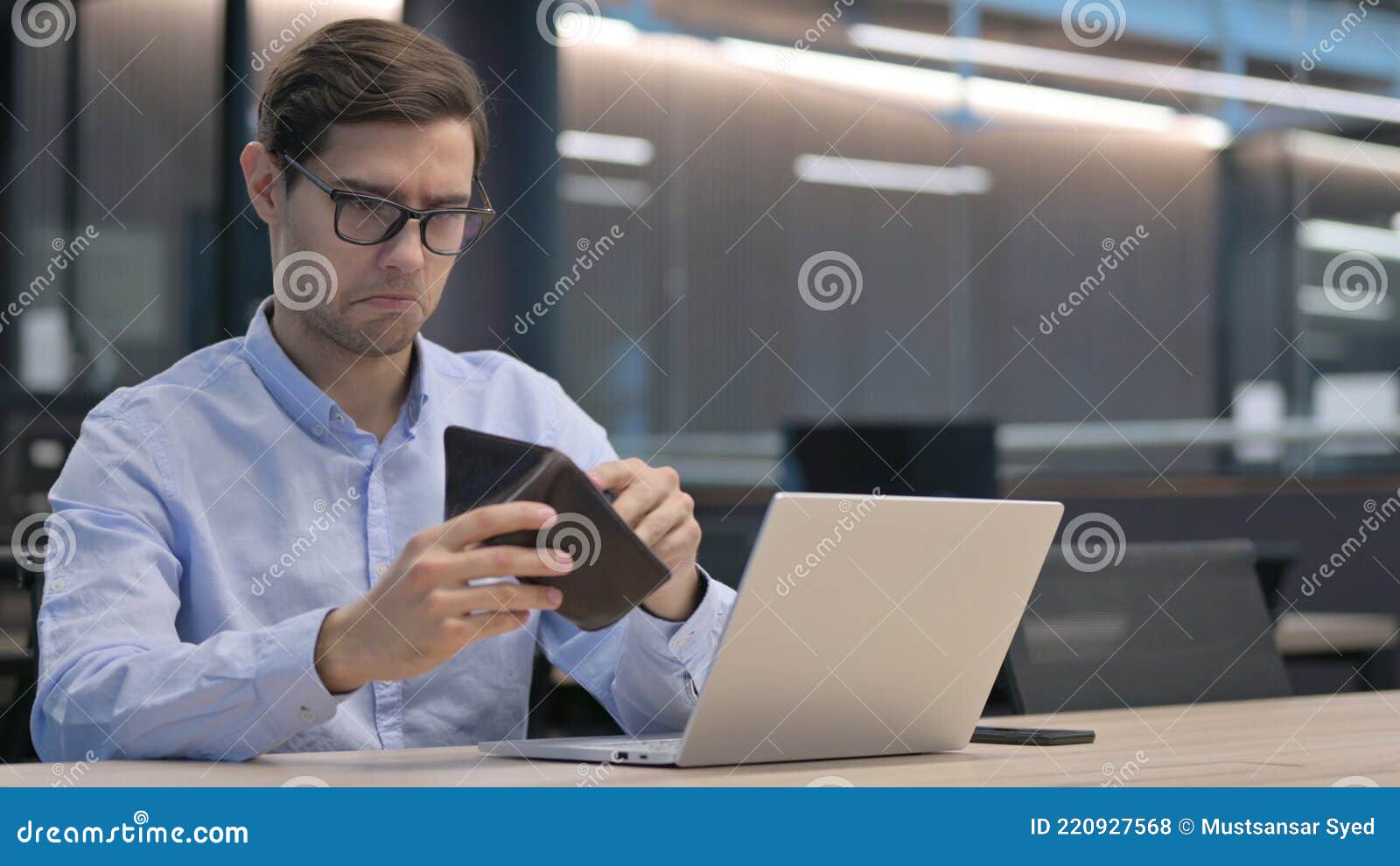 Young Man Checking Empty Wallet in Office Stock Photo - Image of ...