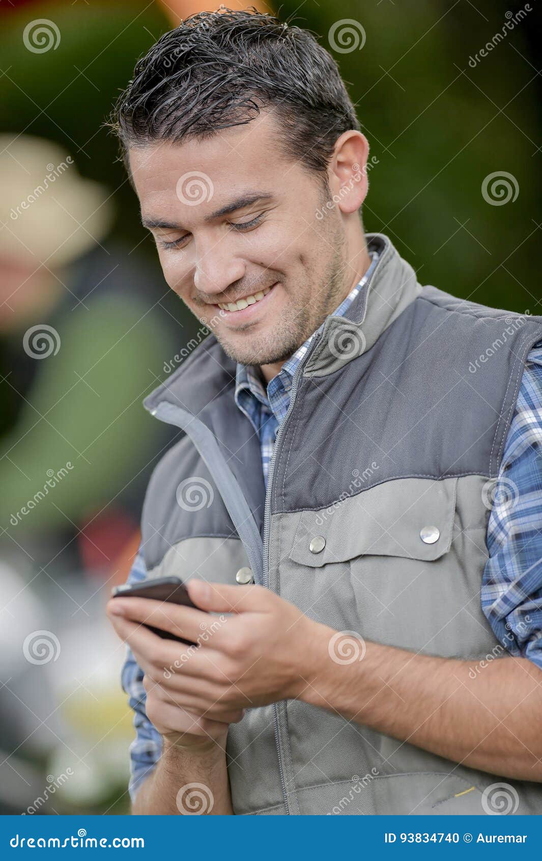 Young man checking phone stock photo. Image of healthy - 93834740