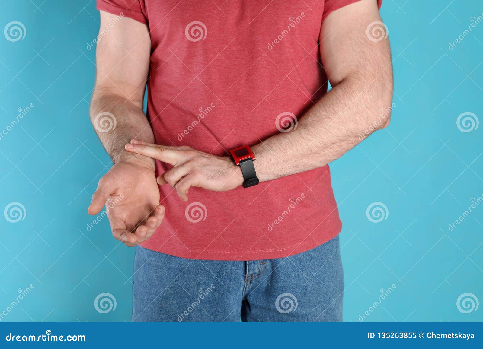 Young Man Checking Pulse on Color Background Stock Image - Image of ...