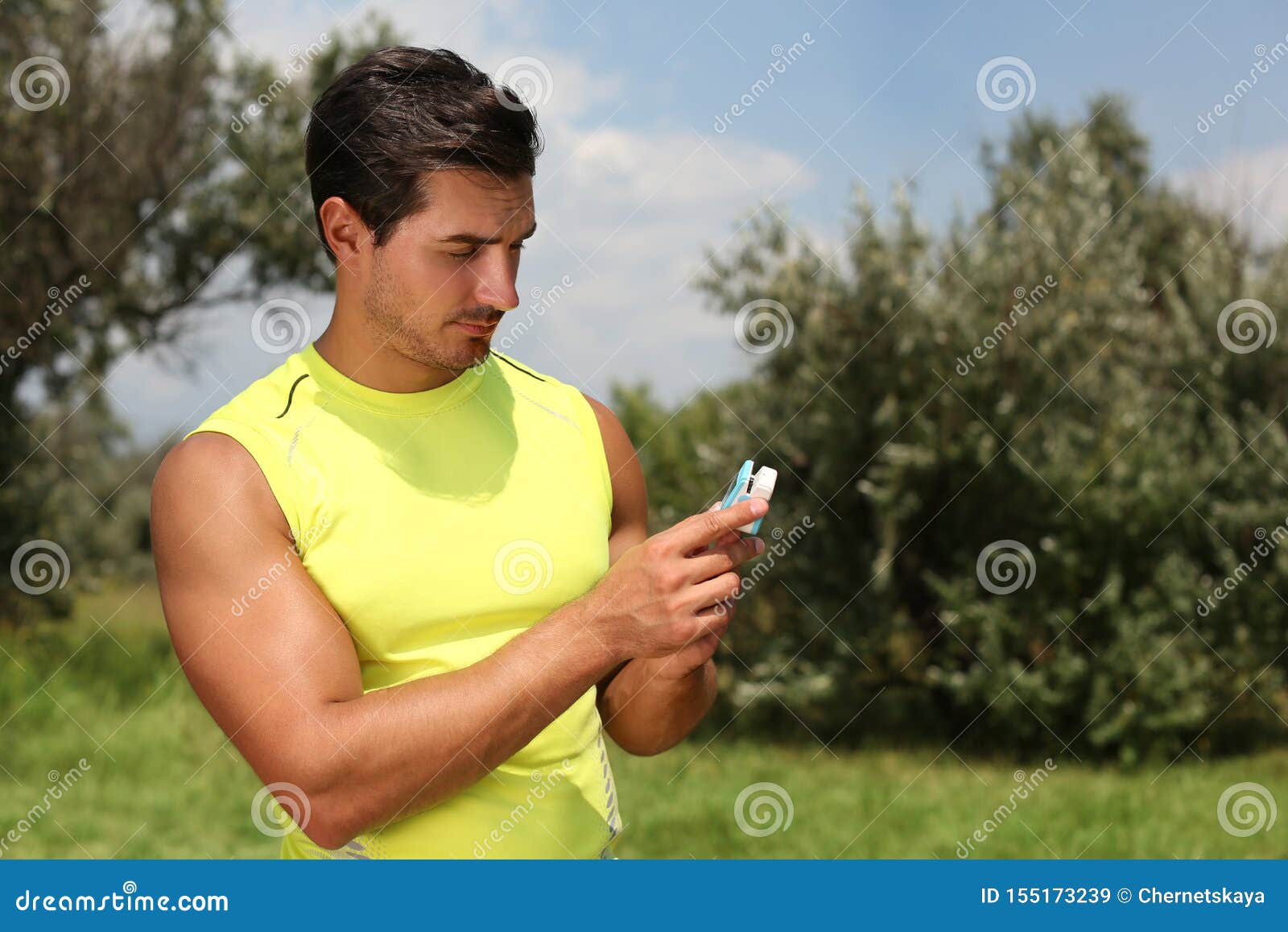 Young Man Checking Pulse with Medical after Training in Park. Space for ...
