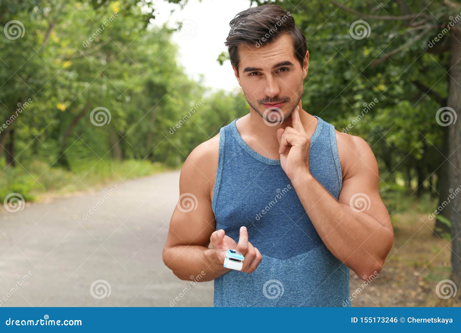 Young Man Checking Pulse with Medical after Training in Park. Space for ...