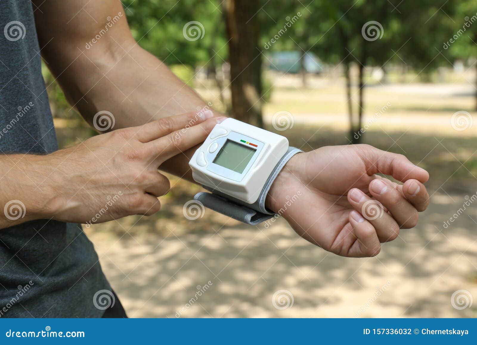 Young Man Checking Pulse with Medical Device after Training Stock Photo ...